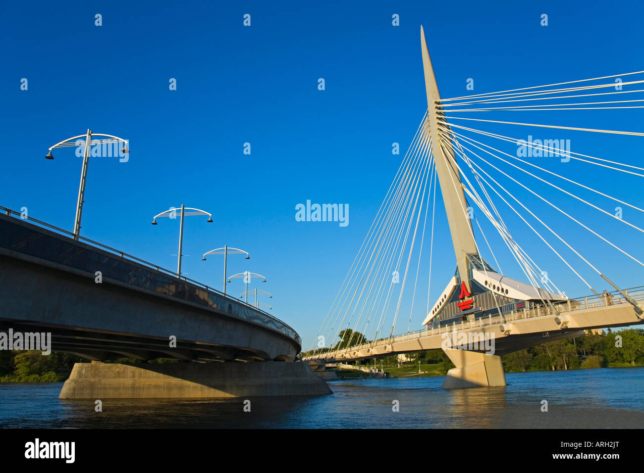 Bridge across a river, Esplanade Riel Pedestrian Bridge, Red River ...