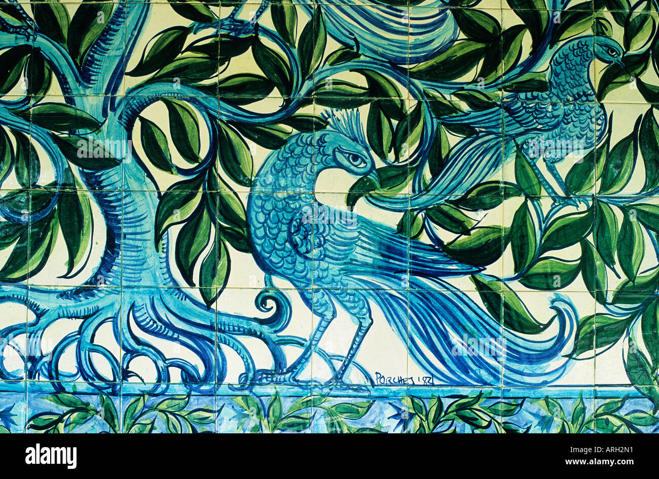 Detail of richly coloured Azulejo tiles depicting stylised trees and ...