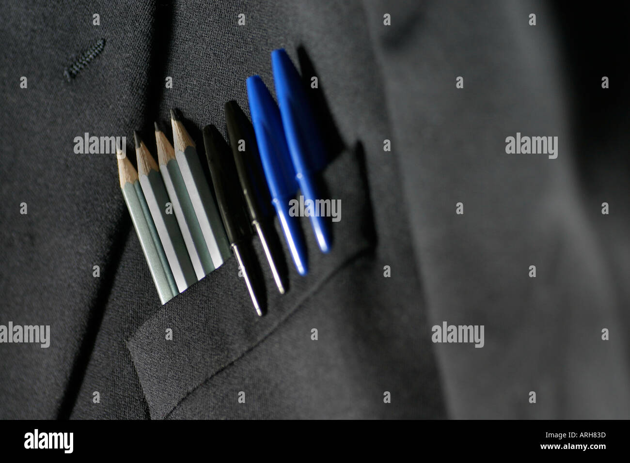 Pencils and Pens in a suit jacket pocket Stock Photo - Alamy