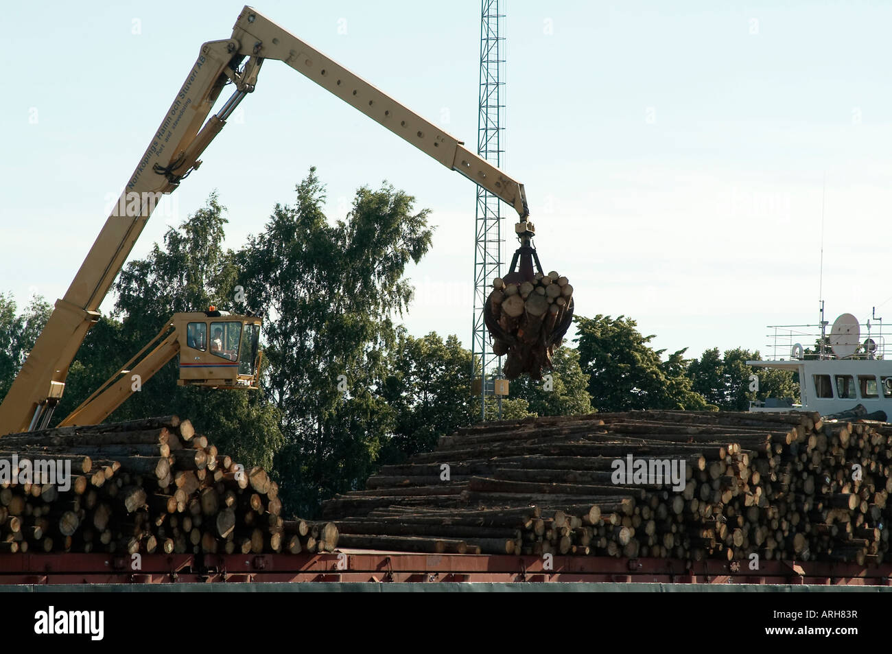 timber export wood sweden log loading boat water industry industrial ...