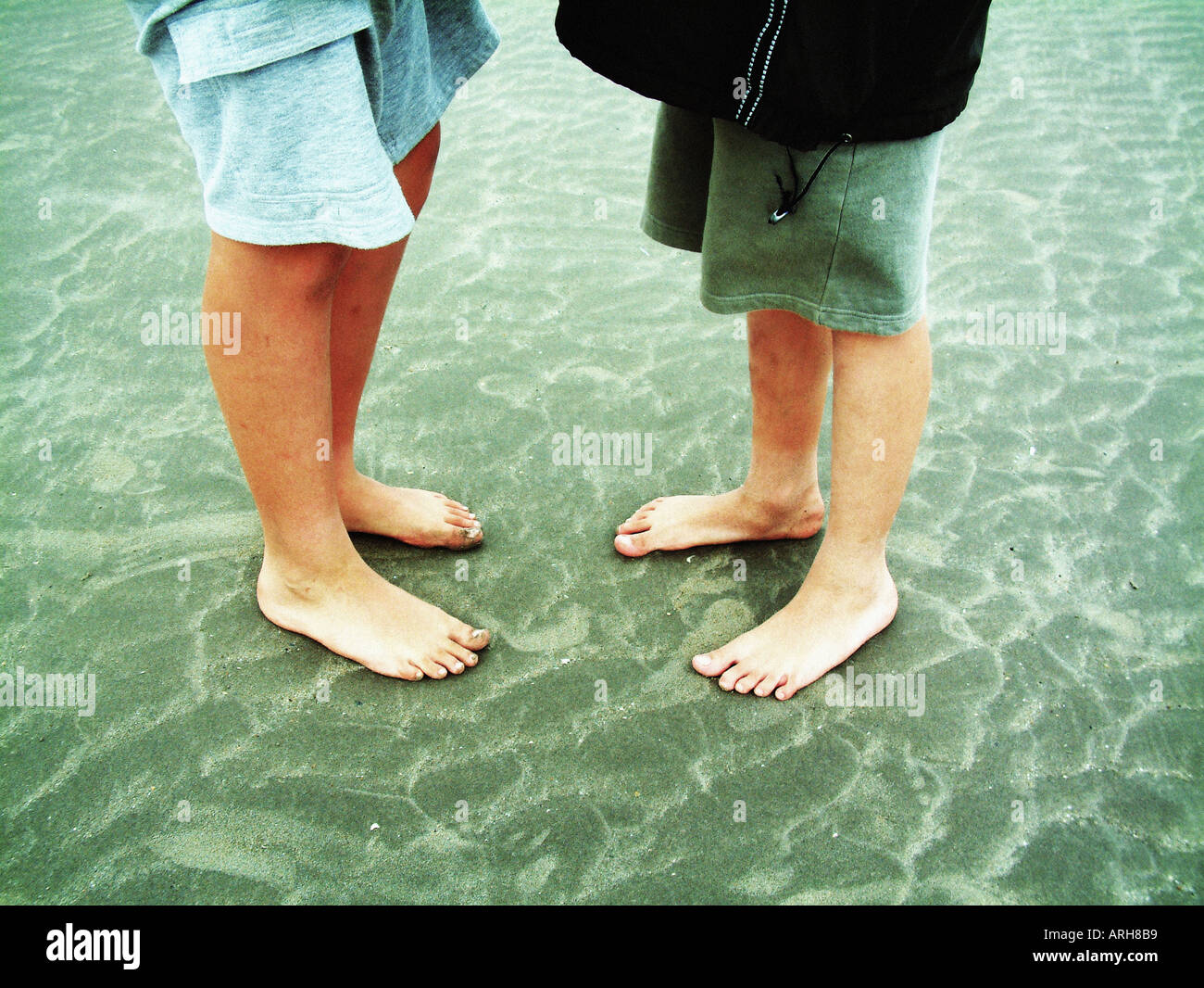 Two Pairs Of Feet Stock Photo - Alamy