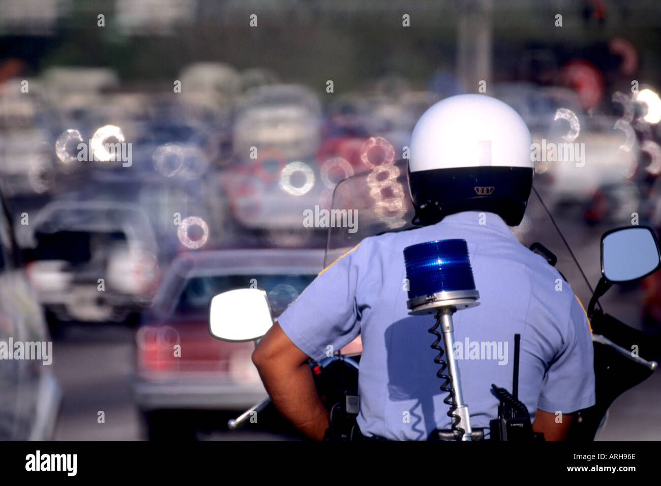 Motorcycle policeman abstract in traffic with radar Stock Photo - Alamy