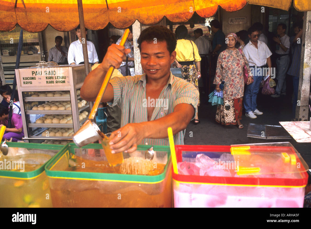 Native vendor in a colorful Malaysian market Stock Photo - Alamy