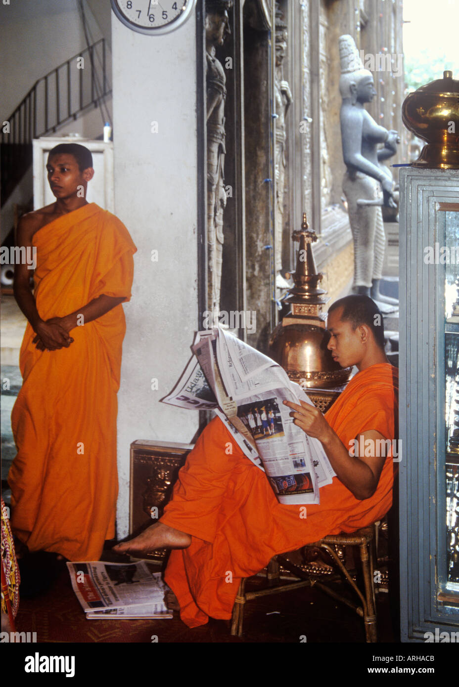Buddhist monks with newspaper at the Gangamara Temple in Colombo Sri ...
