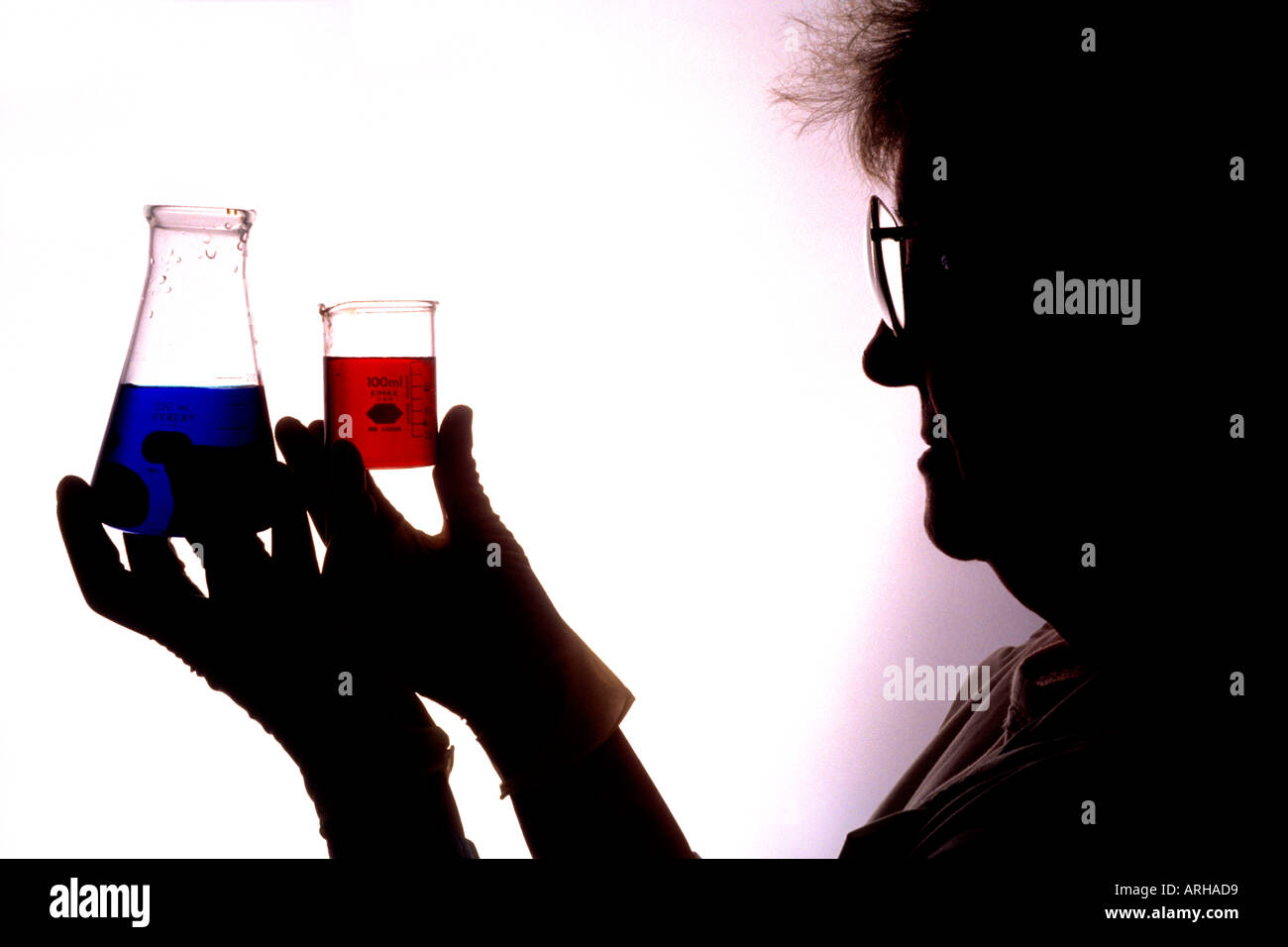 Medical Lab Technician Comparing Colorful Chemistry Stock Photo - Alamy