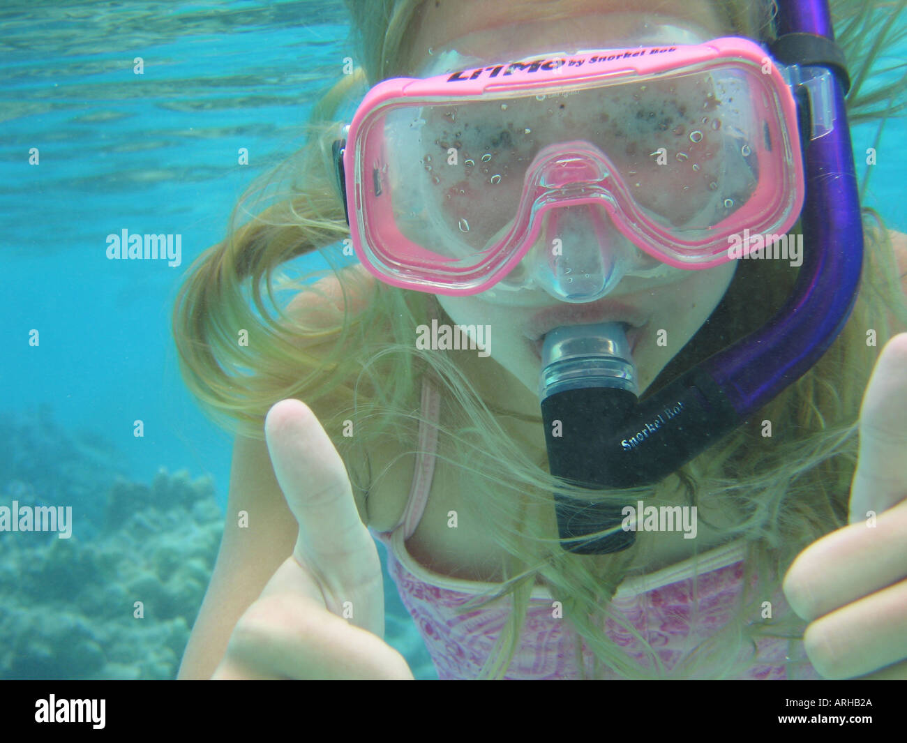 Close up of a young woman scuba diving Moorea Tahiti French Polynesia ...