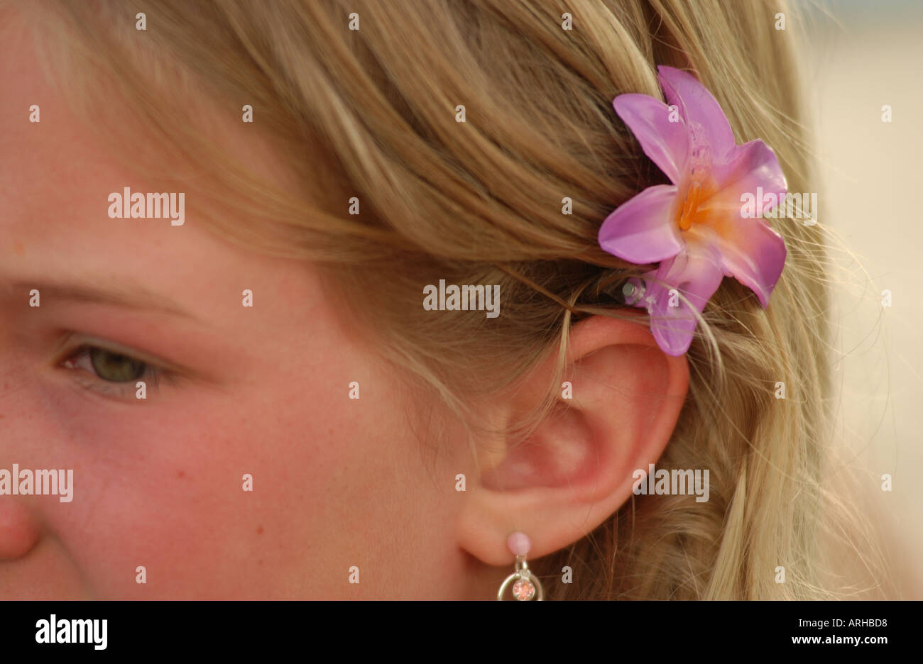 Wearing flower behind ear hi-res stock photography and images - Alamy
