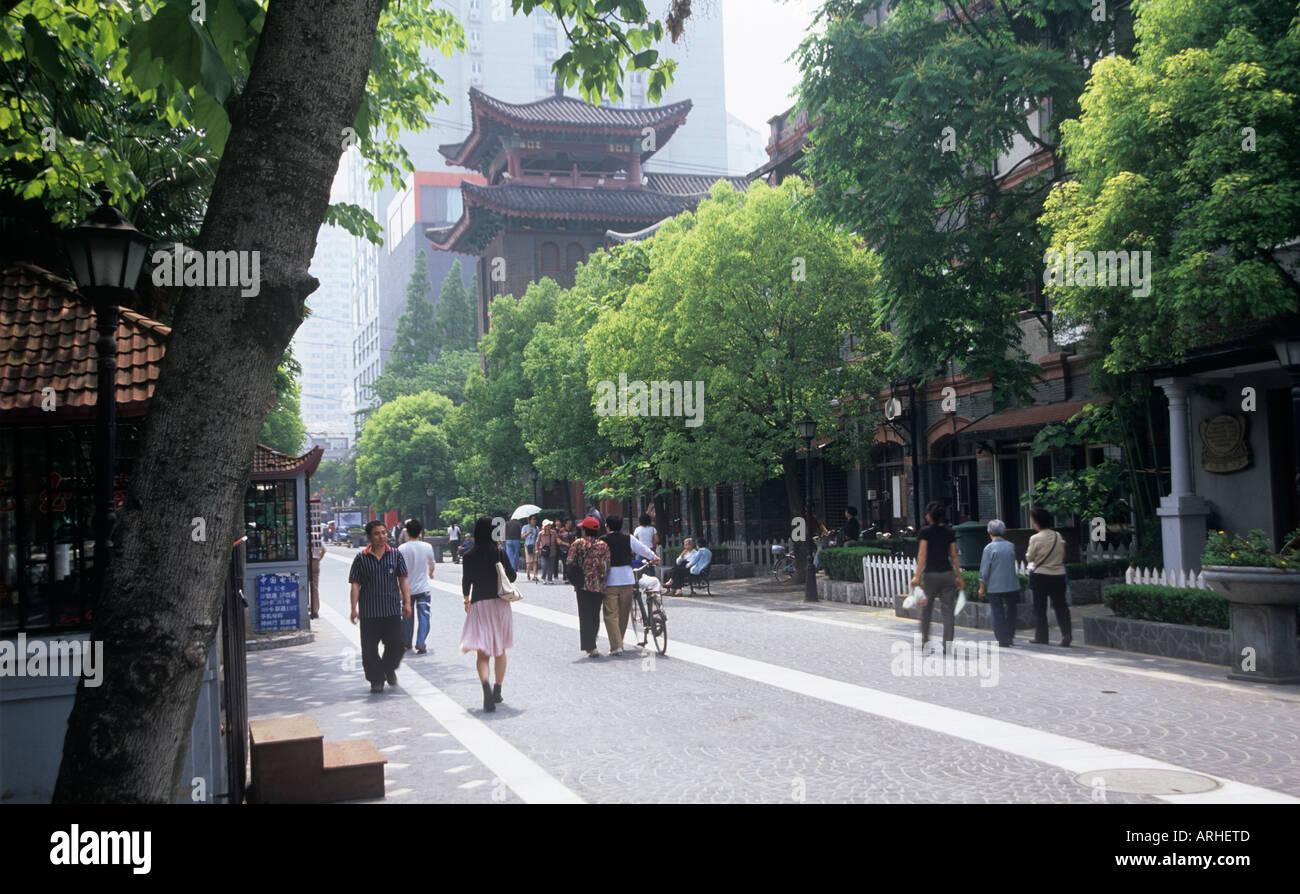 People on busy Doulun Lu Cultural Street Hongde Church in centre of ...