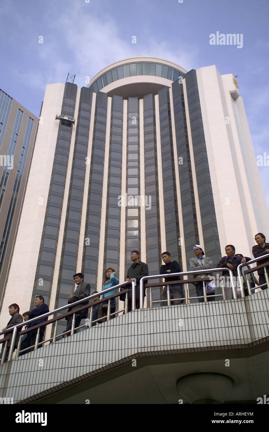 People looking down from bridge Stock Photo - Alamy