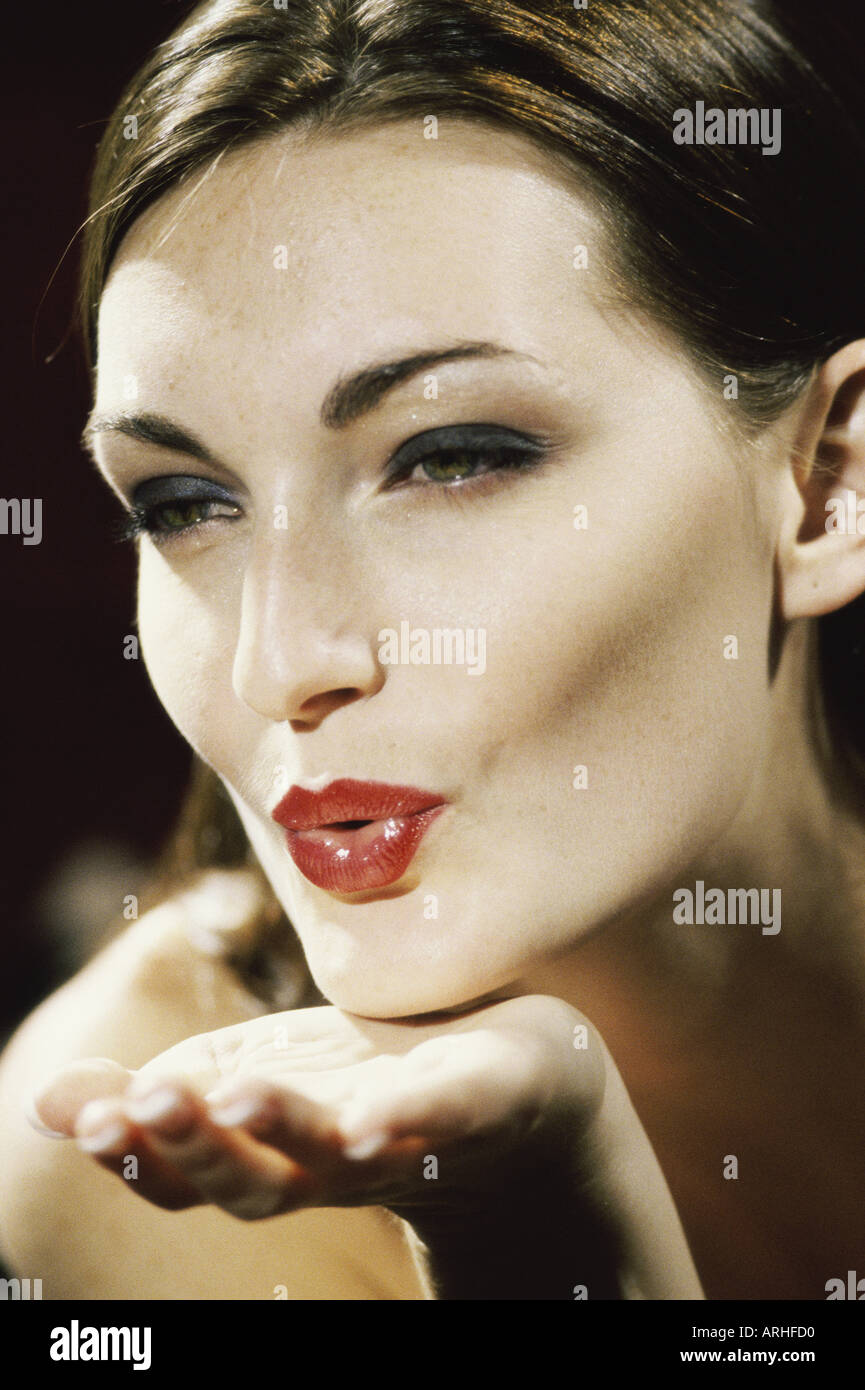 Woman puckering lips brunette hi-res stock photography and images - Alamy