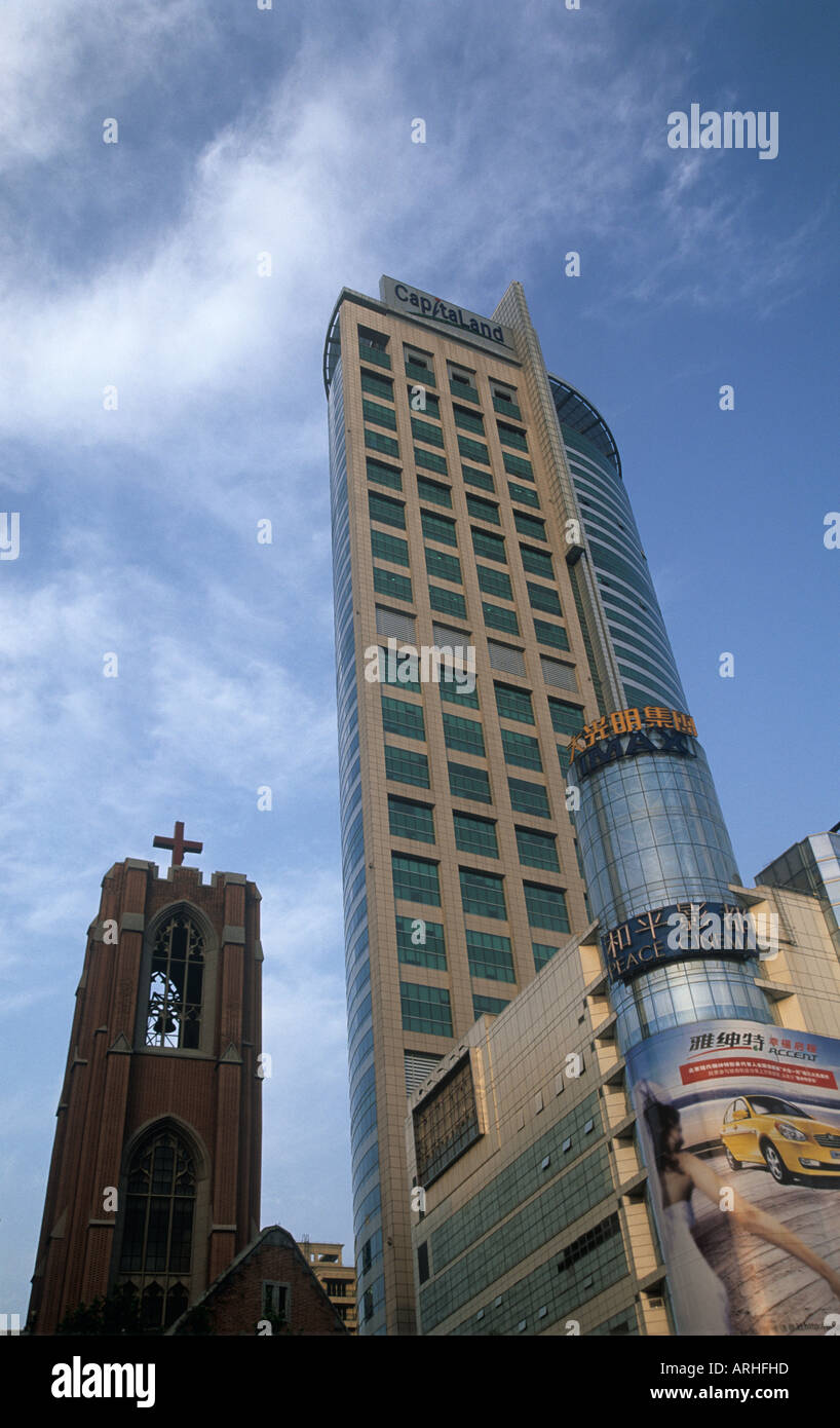 Bell tower of Moore Memorial Church amist modern skyscrapers in Renmin ...