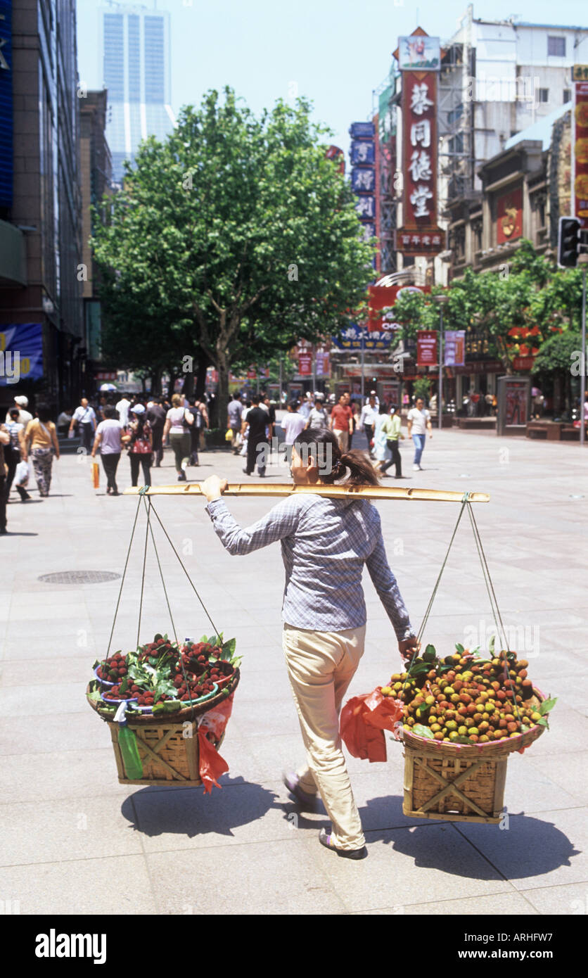 Woman carrying food in baskets hi-res stock photography and images - Alamy