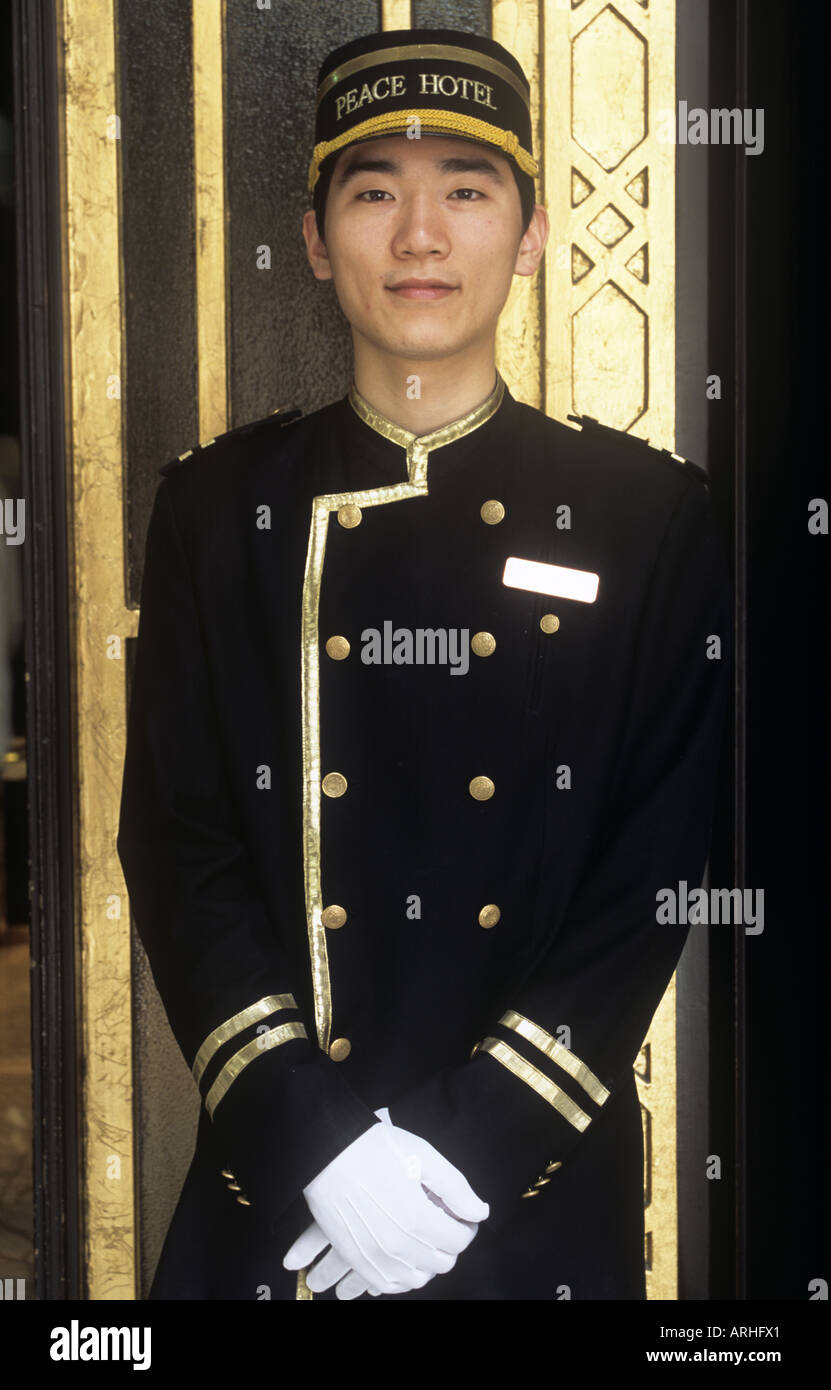 Door greeter at the Peace Hotel posing for the photograph The Bund ...