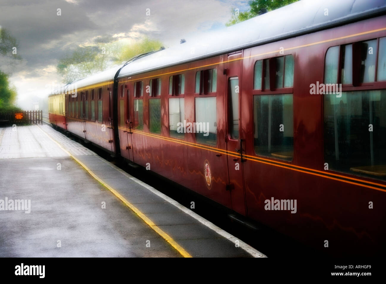 Train at station during storm Stock Photo - Alamy