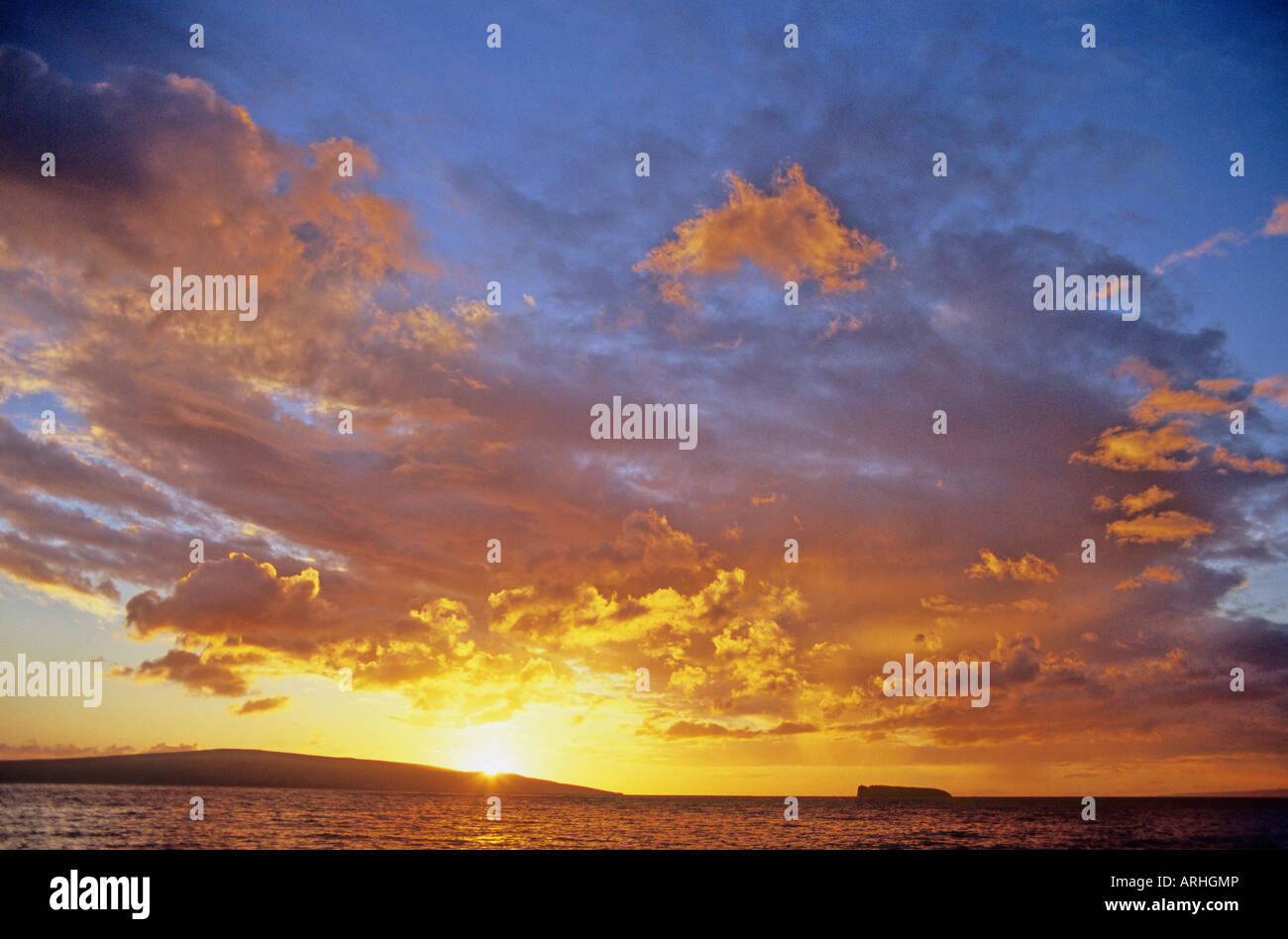 View from Big Beach at Makena State Park on Maui of sun setting behind ...
