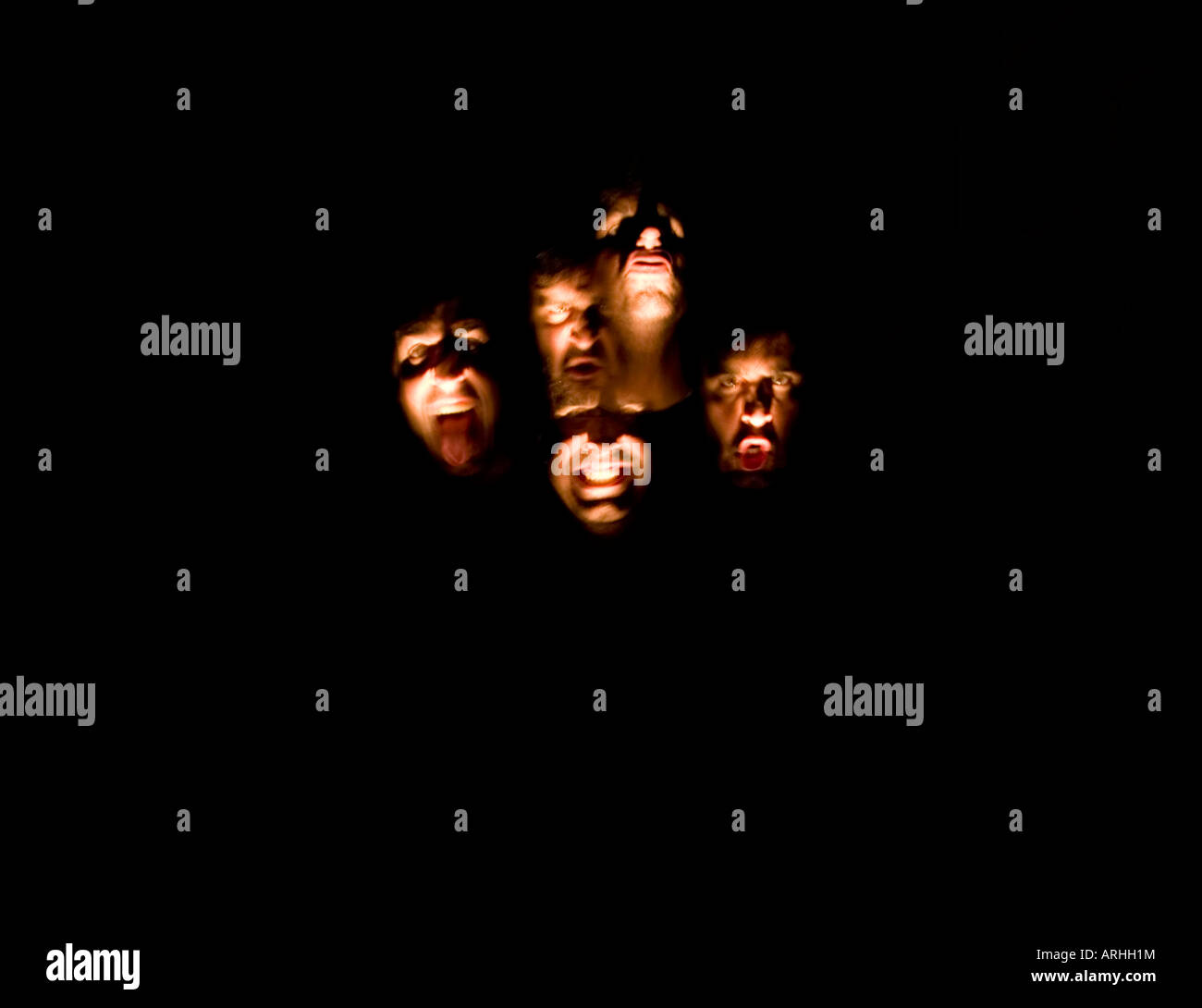 Faces in the dark Stock Photo - Alamy