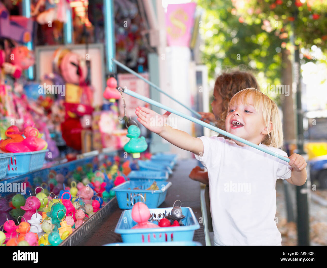 Little girls at a fair Stock Photo - Alamy