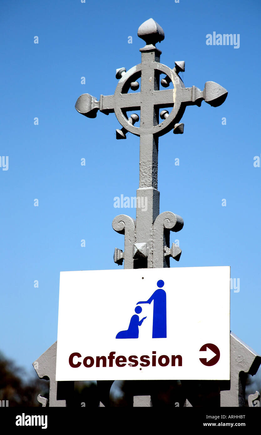 Direction sign for confessions in Lourdes France 2007 Stock Photo - Alamy