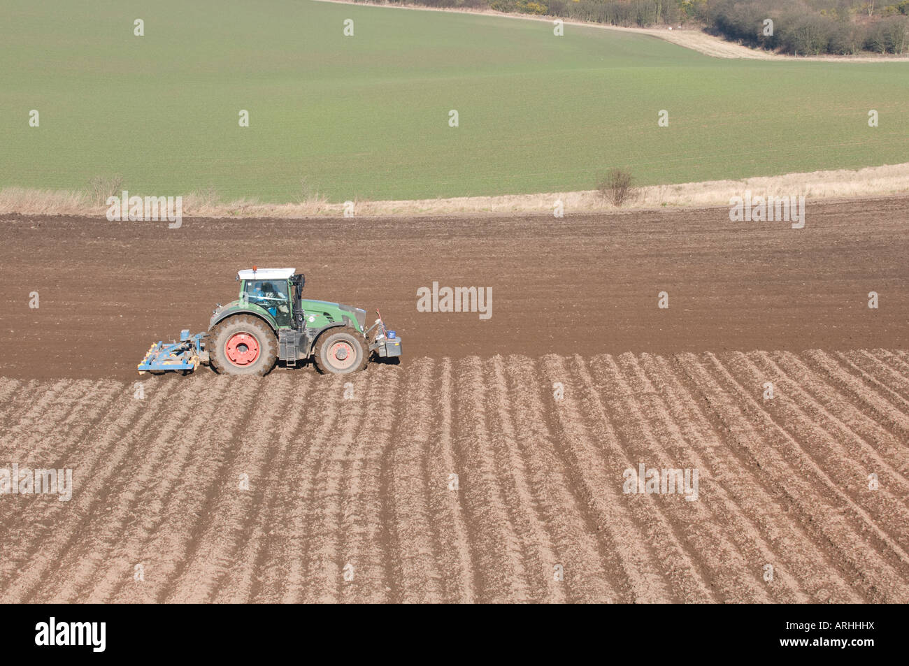Tractor ploughing field Stock Photo - Alamy