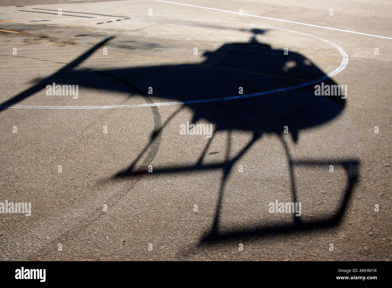 A shadow of a helicopter flying Stock Photo - Alamy
