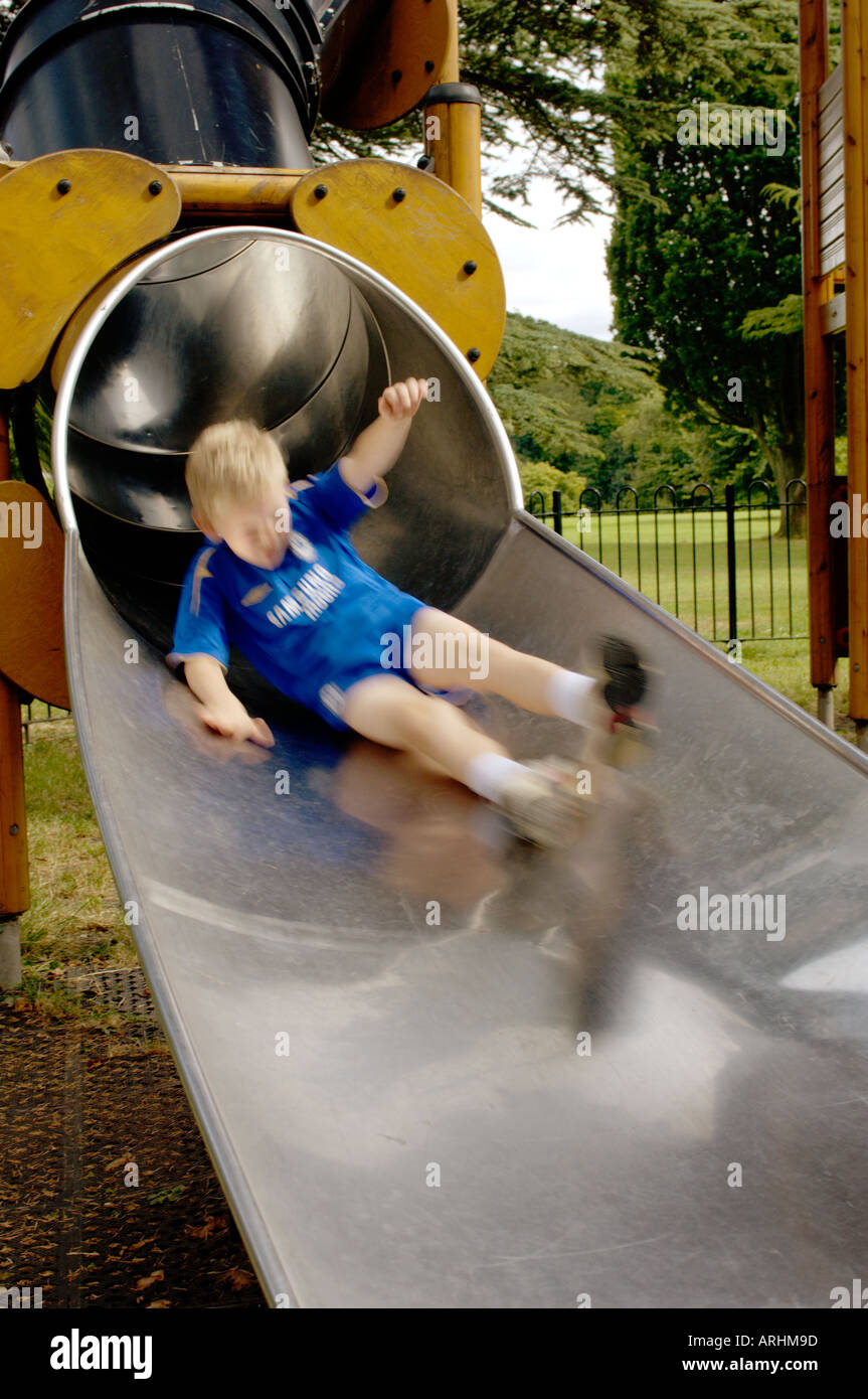 Child on playground tube slide blurred with motion Blaise Castle Estate ...