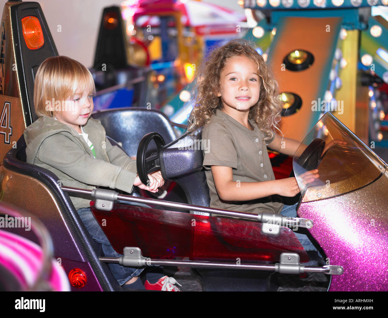 Little girls on merry go round Stock Photo - Alamy