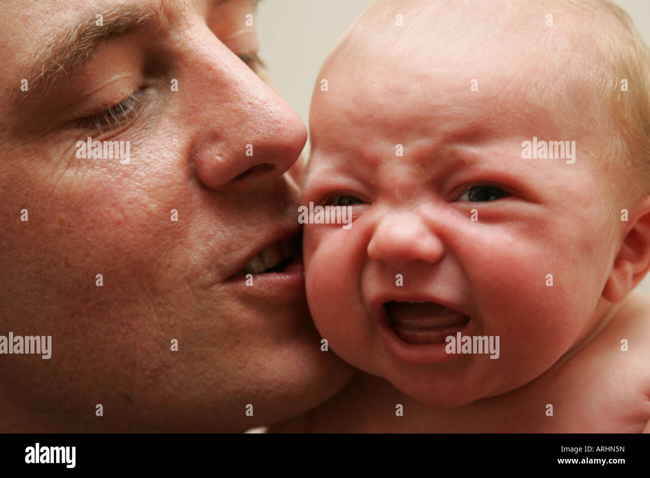 crying baby with father Stock Photo - Alamy