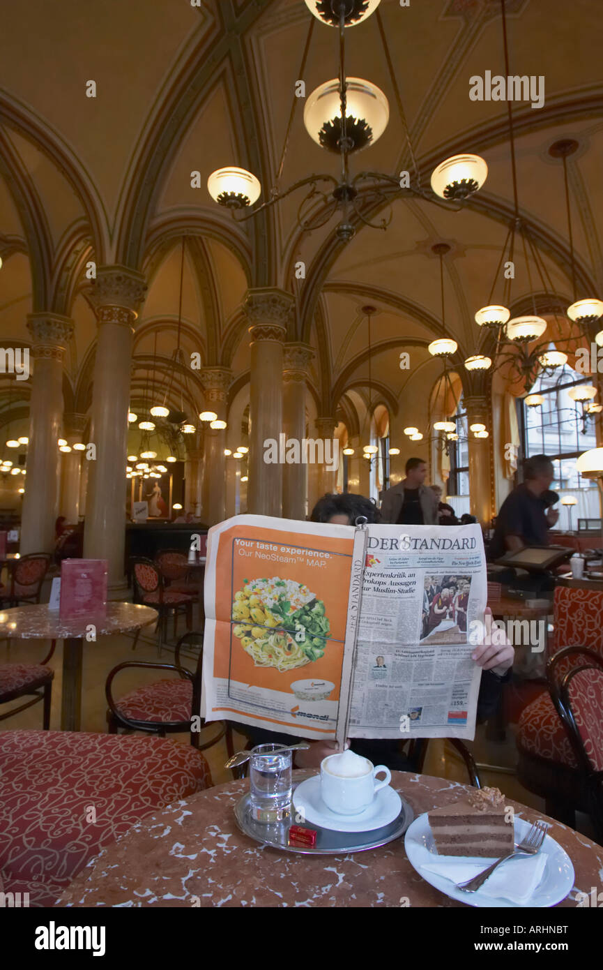Young Woman Sitting In Viennese Coffee House Reading Newspaper Stock ...