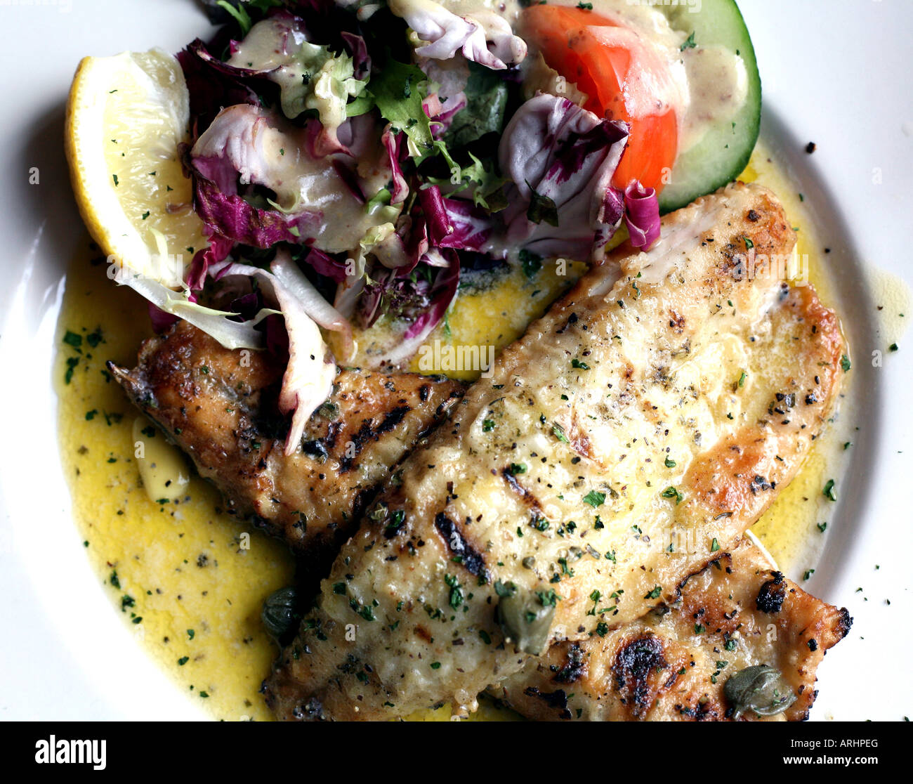 Plate of sea bass fish in London restaurant 2007 Stock Photo - Alamy