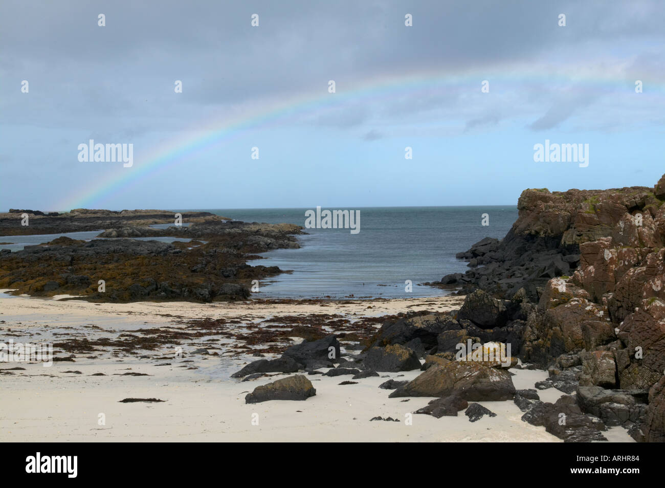 Isle of Mull Freya shell sand beach near Croig with rainbow over sea ...