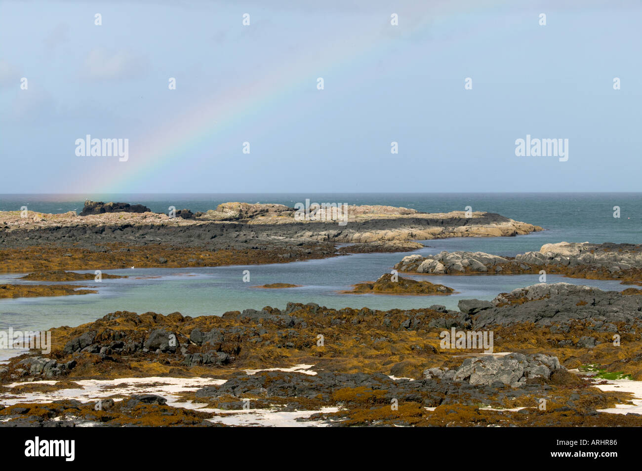 Isle of Mull Freya shell sand beach near Croig with rainbow over sea ...