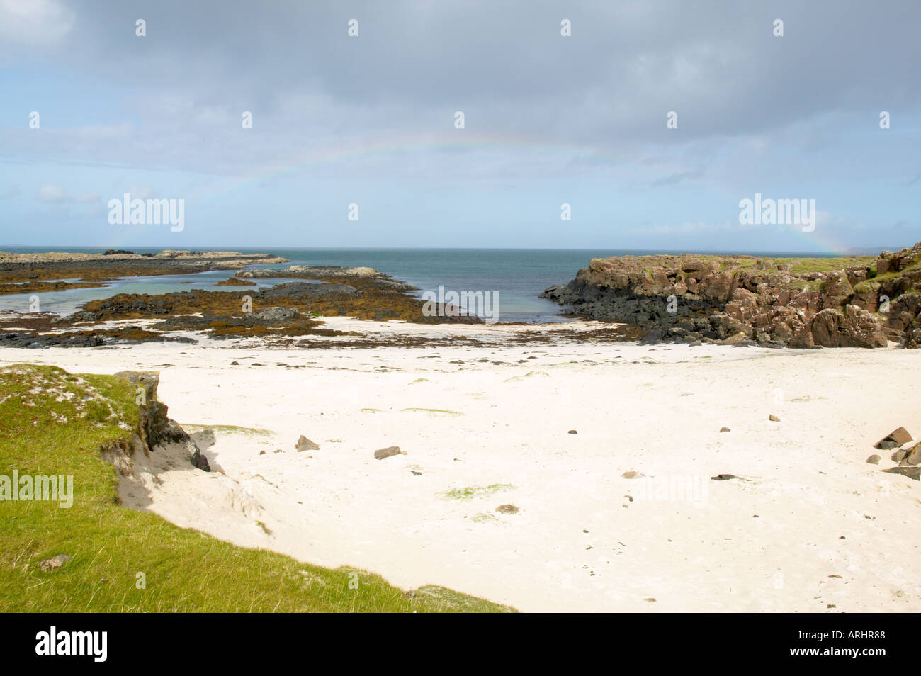 Isle of Mull Freya shell sand beach near Croig with rainbow over sea ...