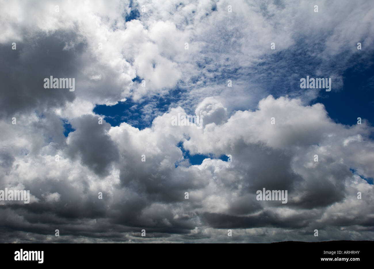 Picturesque sea of high noon Clouds in a blue Sky with cool colors in a ...