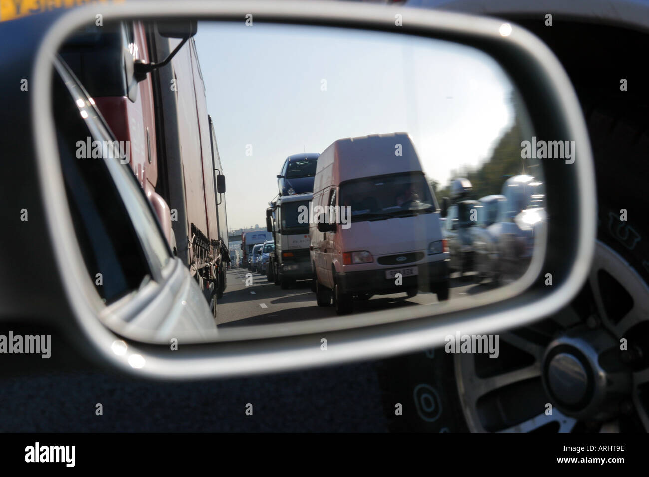 traffic jam seen through drivers side wing mirror of car Stock Photo ...
