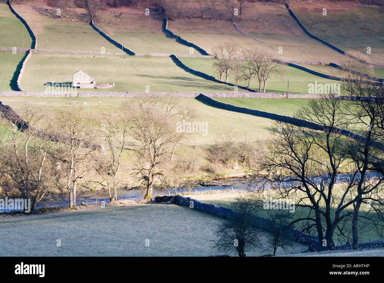 River Wharfe flowing through fields by Kettlewell, Yorkshire Dales ...