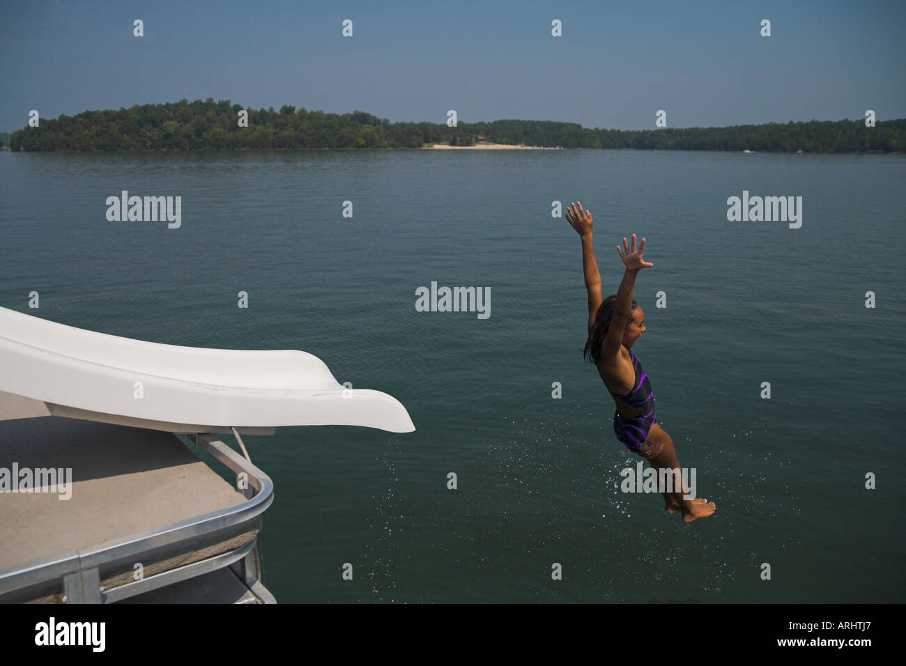 Girl diving into lake hi-res stock photography and images - Alamy