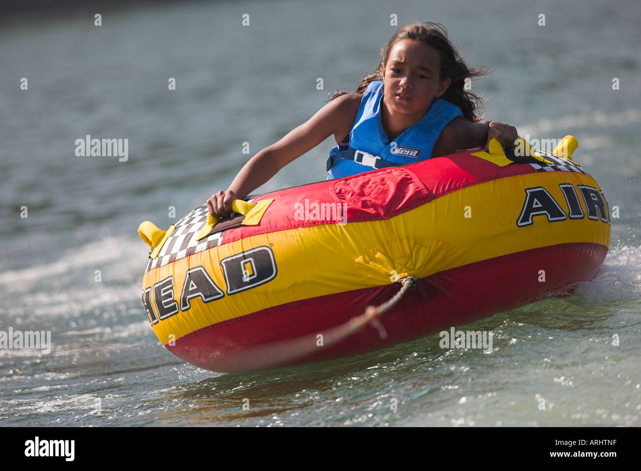 Girl enjoying the ride on a water tube Stock Photo - Alamy