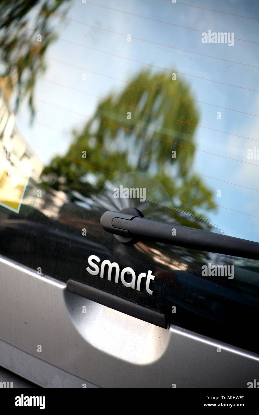 Tree reflected in rear window of Smart car in London street Stock Photo ...