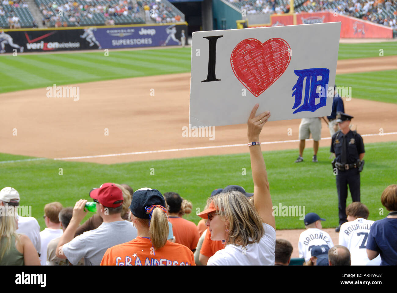 Fans hold signs in support of the Detroit Tiger Professional Major ...