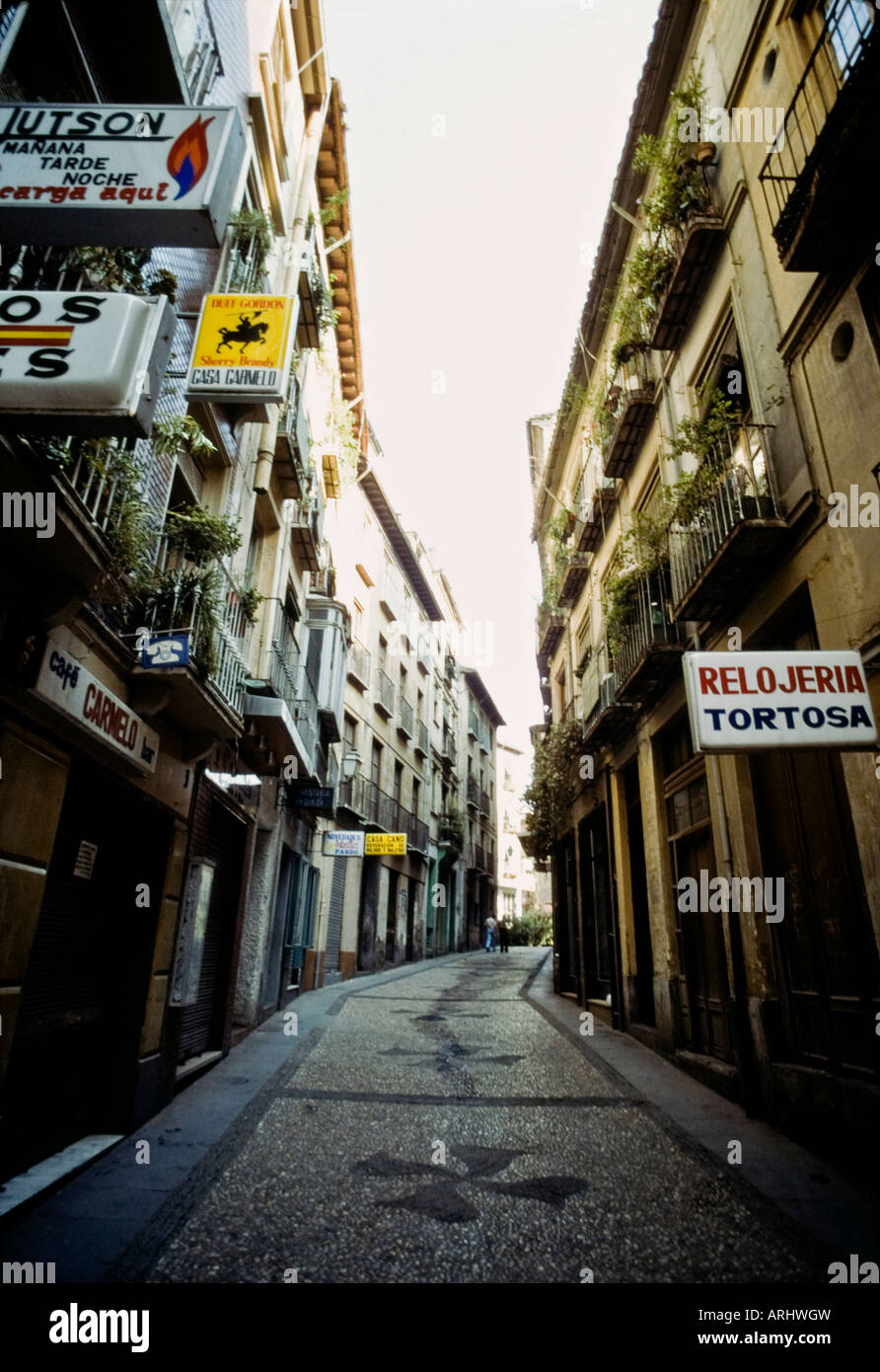 Typical narrow mosaic street in Granada Spain Stock Photo - Alamy