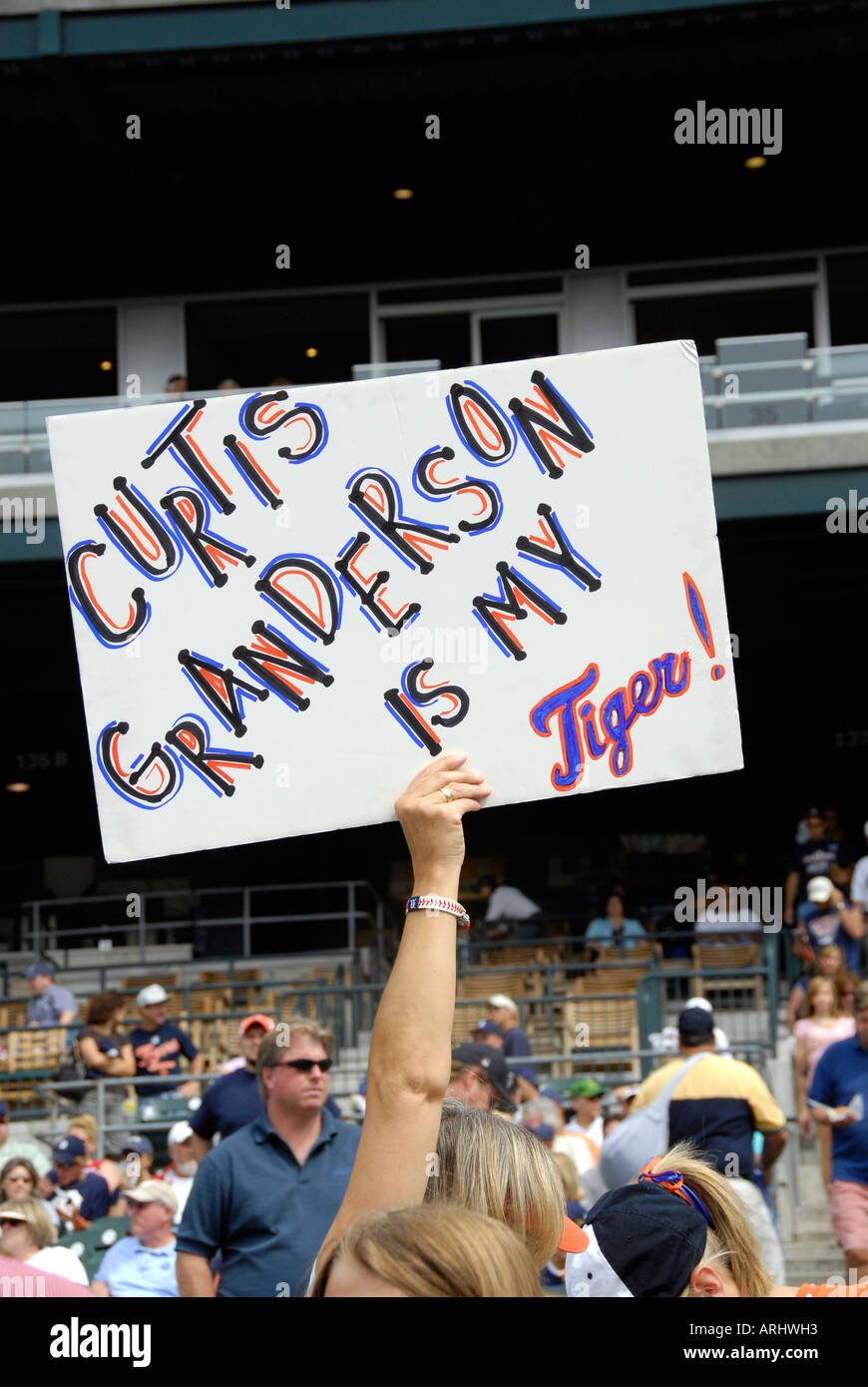 Fans hold signs in support of the Detroit Tiger Professional Major ...