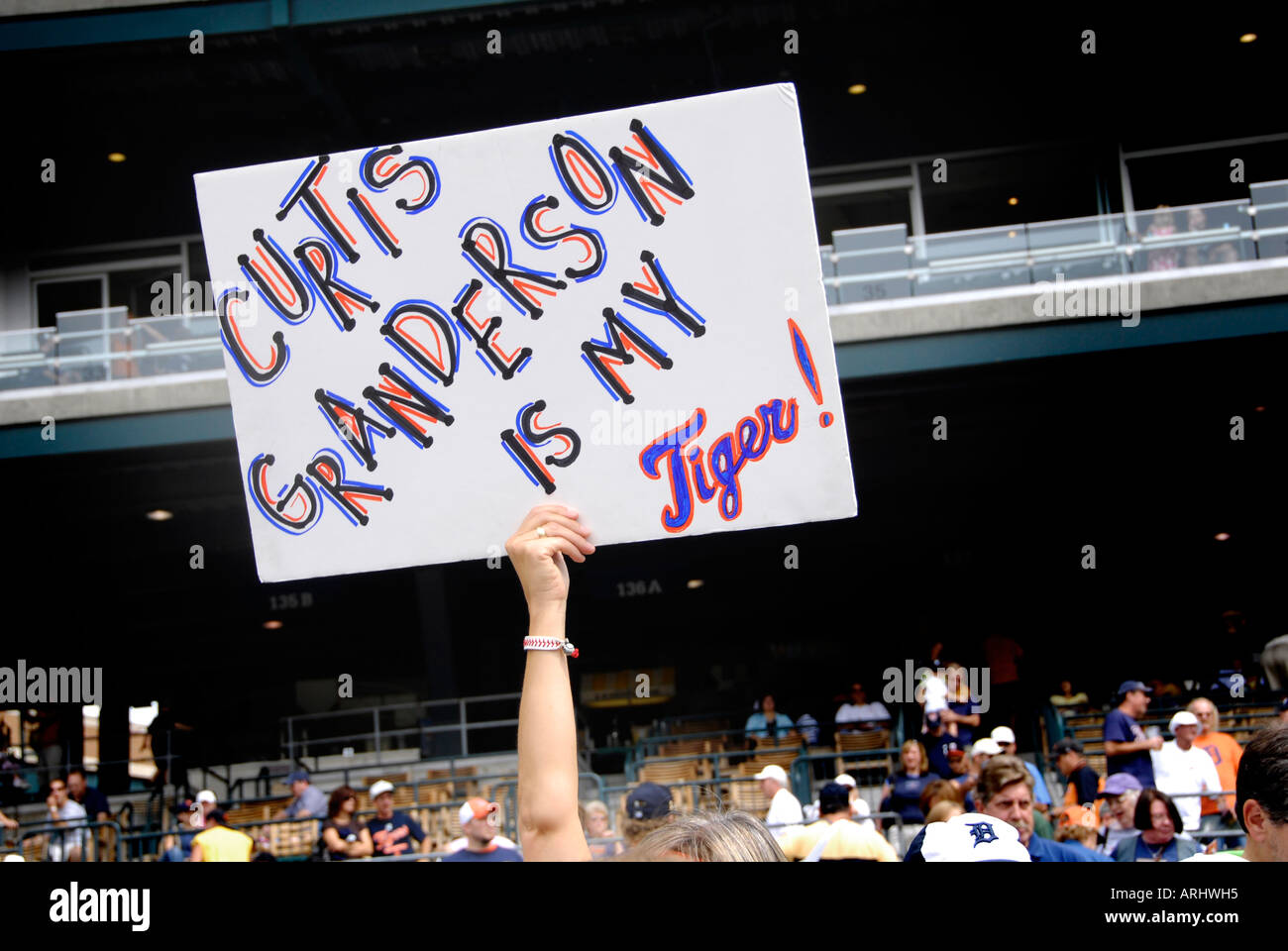 Fans hold signs in support of the Detroit Tiger Professional Major ...