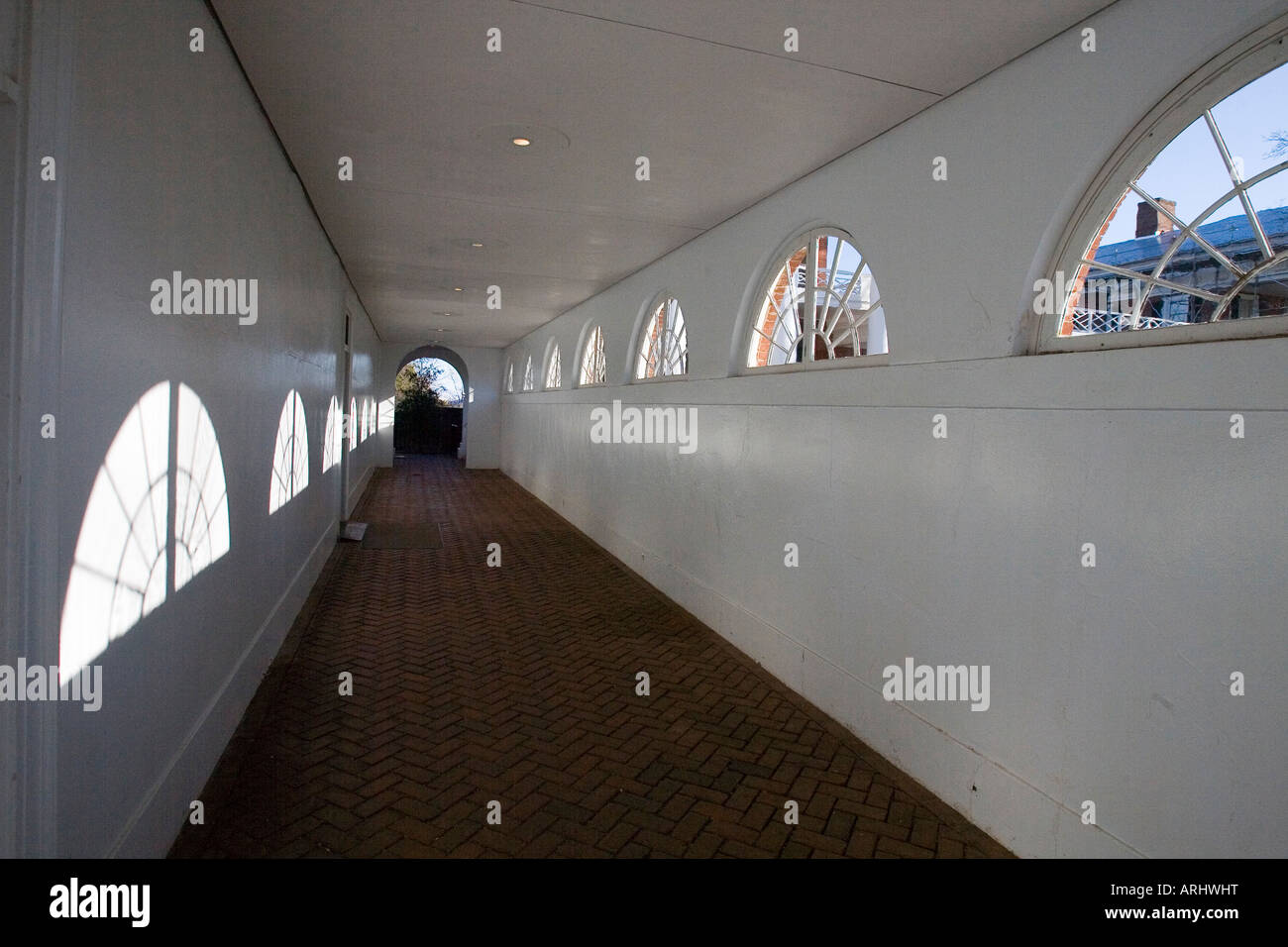 A walkway under the Rotunda at the University of Virginia showing the ...