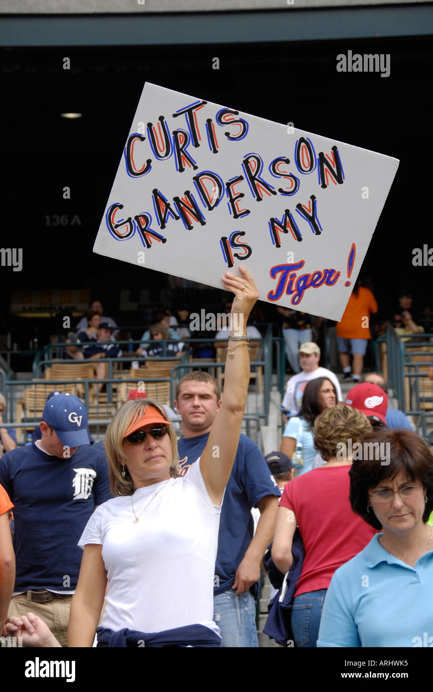 Fans hold signs in support of the Detroit Tiger Professional Major ...