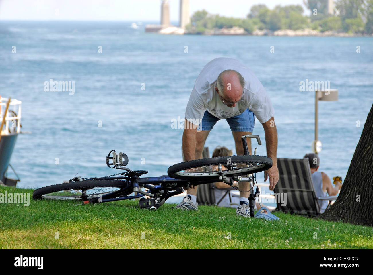 Man gets up after falling of a bicycle Stock Photo - Alamy