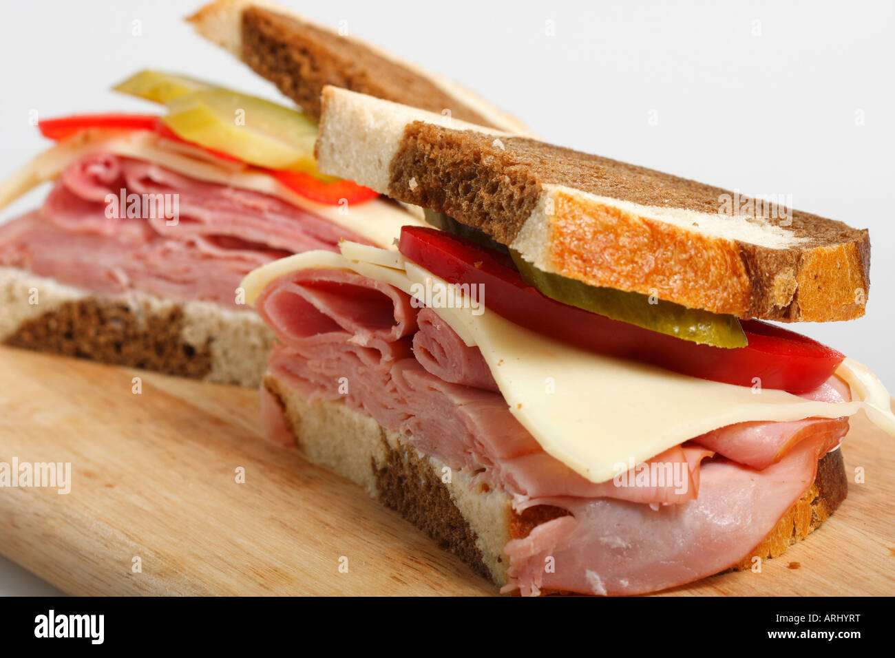 Cross section of sandwiches a bread with ham and cheese on the dining ...