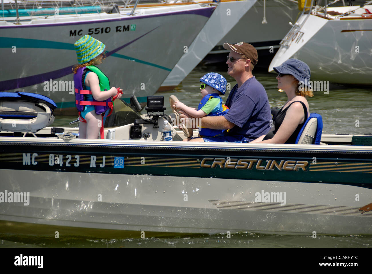 Families enjoy boating as a form of family recreation Stock Photo - Alamy
