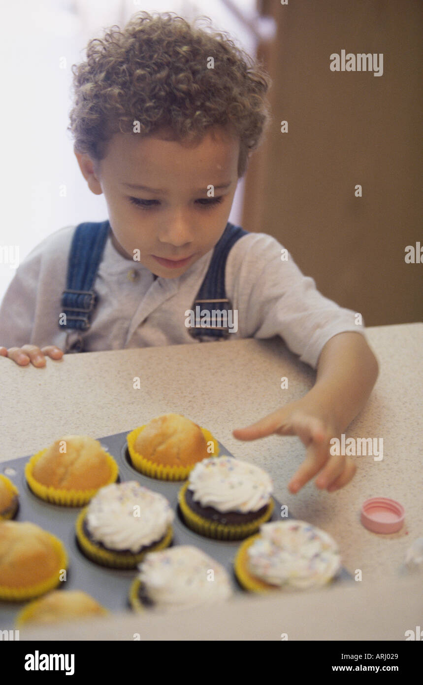 Boy stealing food hi-res stock photography and images - Alamy