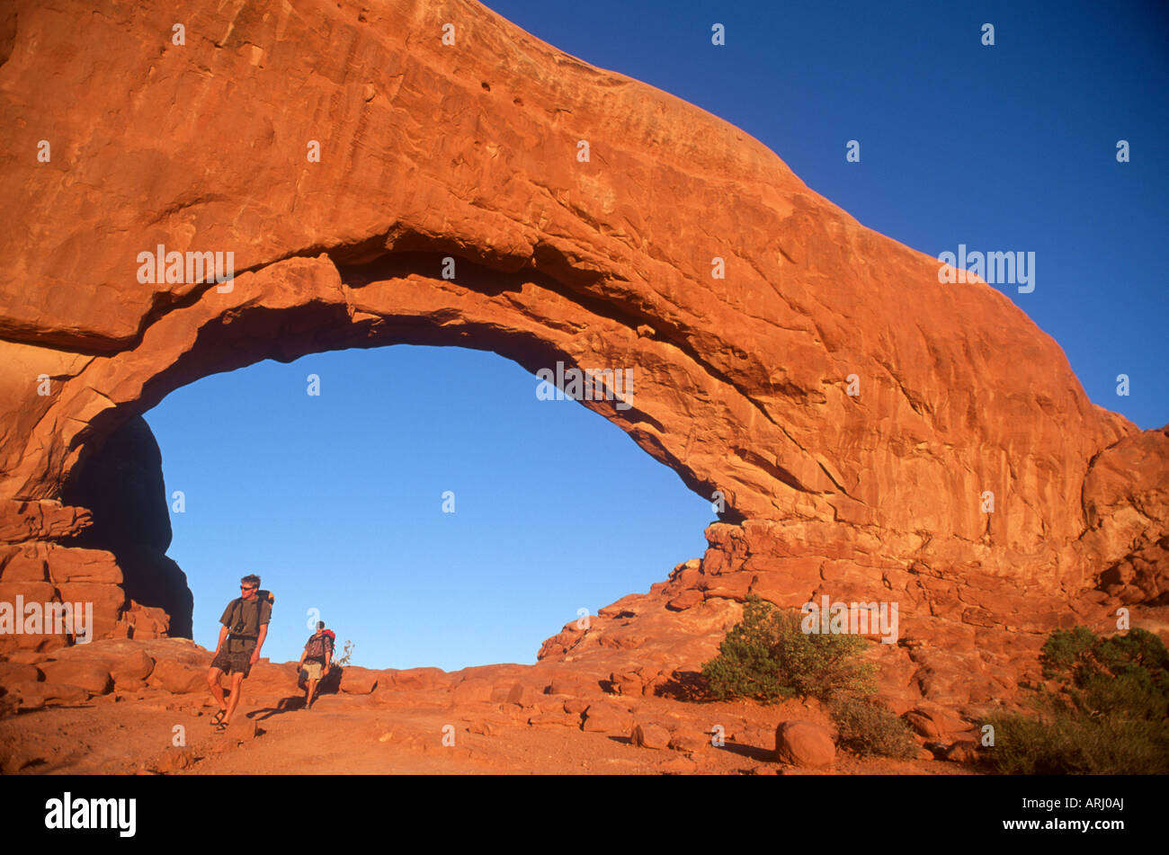 North Window Arch with people at Arches National Park at Sunset Stock ...