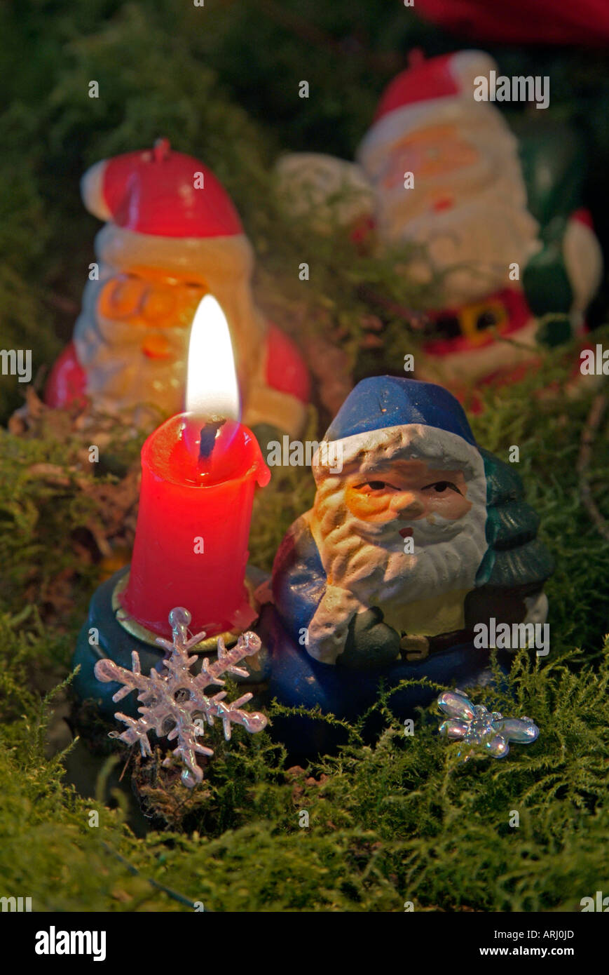 still life with burning candles fir brances and Santa Claus Stock Photo ...